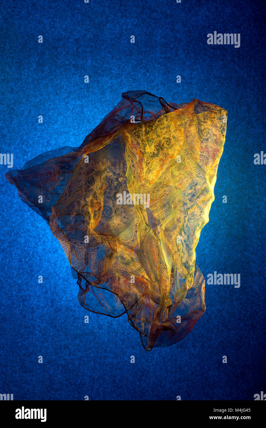 Transparent thin handkerchief on a blue background Stock Photo - Alamy