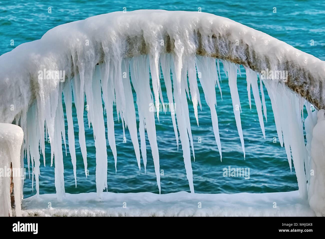 Icy Arch with Icicles Stock Photo - Alamy