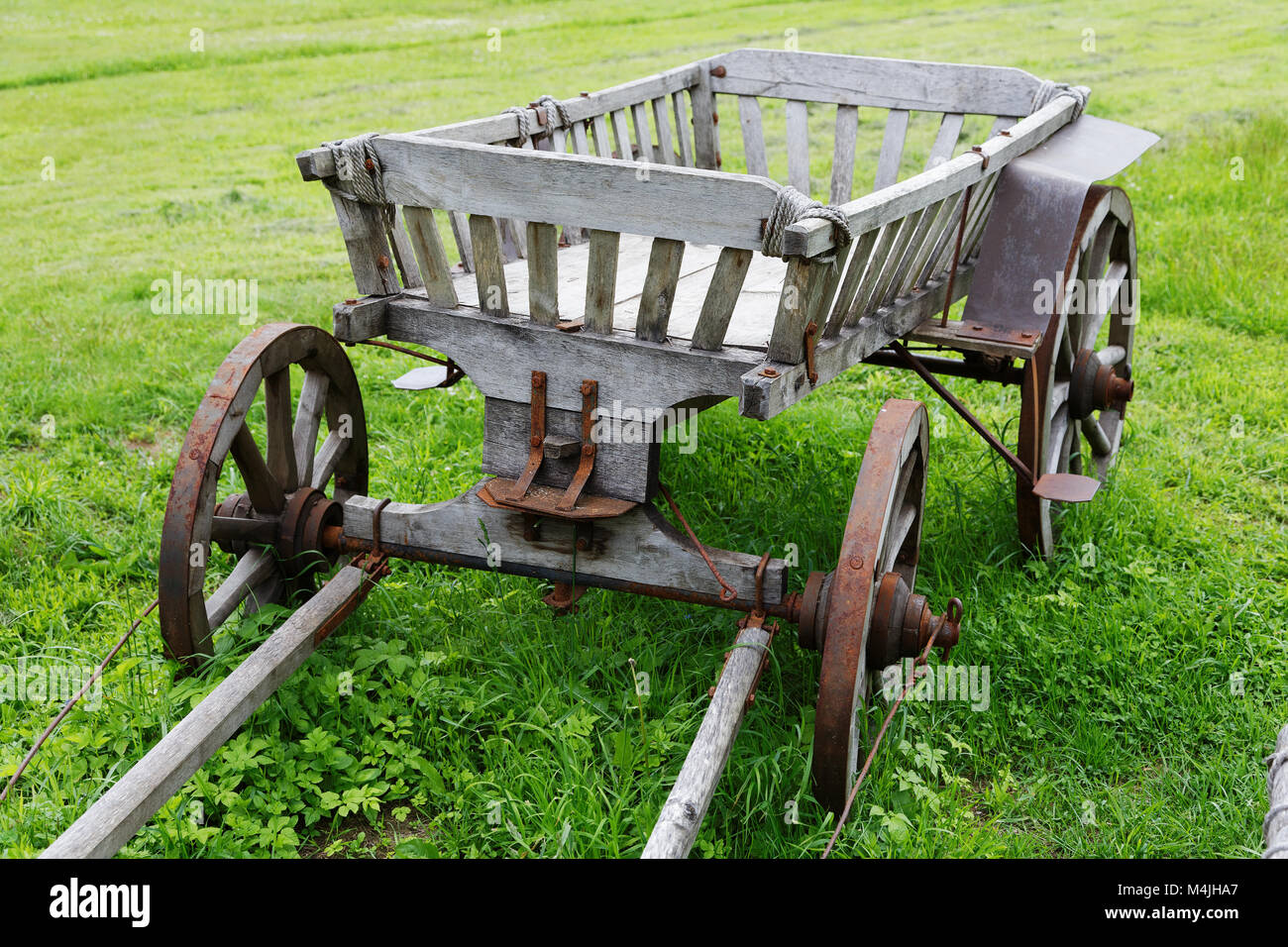 wooden cart on a meadow on a summer day Stock Photo - Alamy