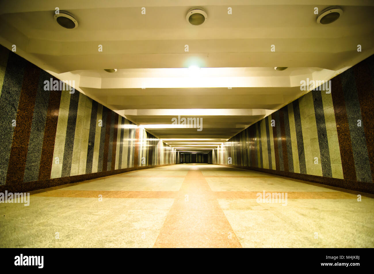 underground passage with lights on without people at night Stock Photo ...
