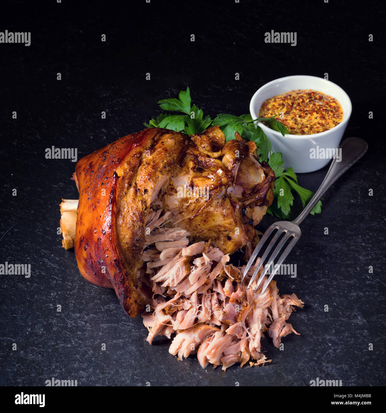 fresh roasted knuckle of pork with mustard Stock Photo - Alamy