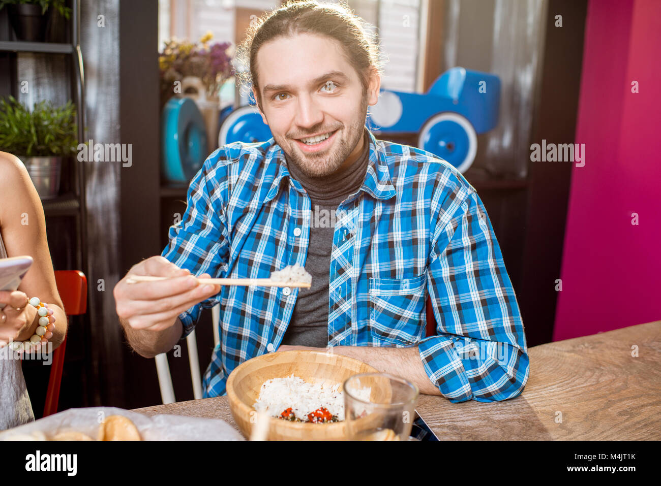 Man eating rice hi-res stock photography and images - Alamy