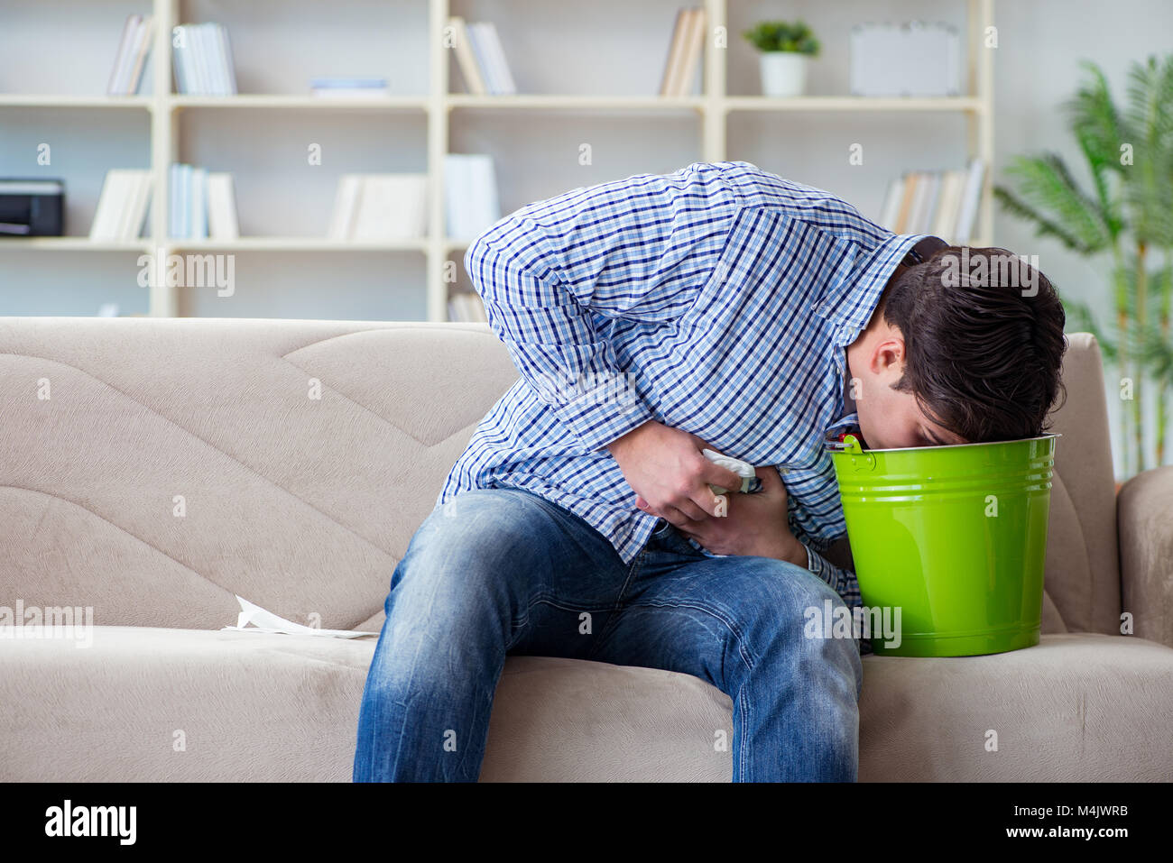 Man suffering from sick stomach and vomiting Stock Photo - Alamy