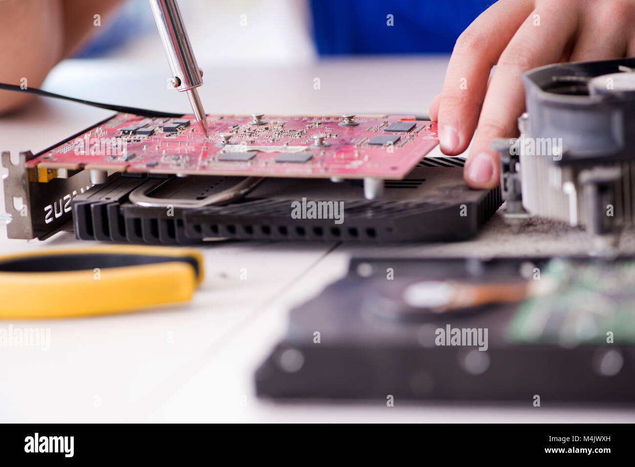 Computer repairman repairing desktop computer Stock Photo - Alamy