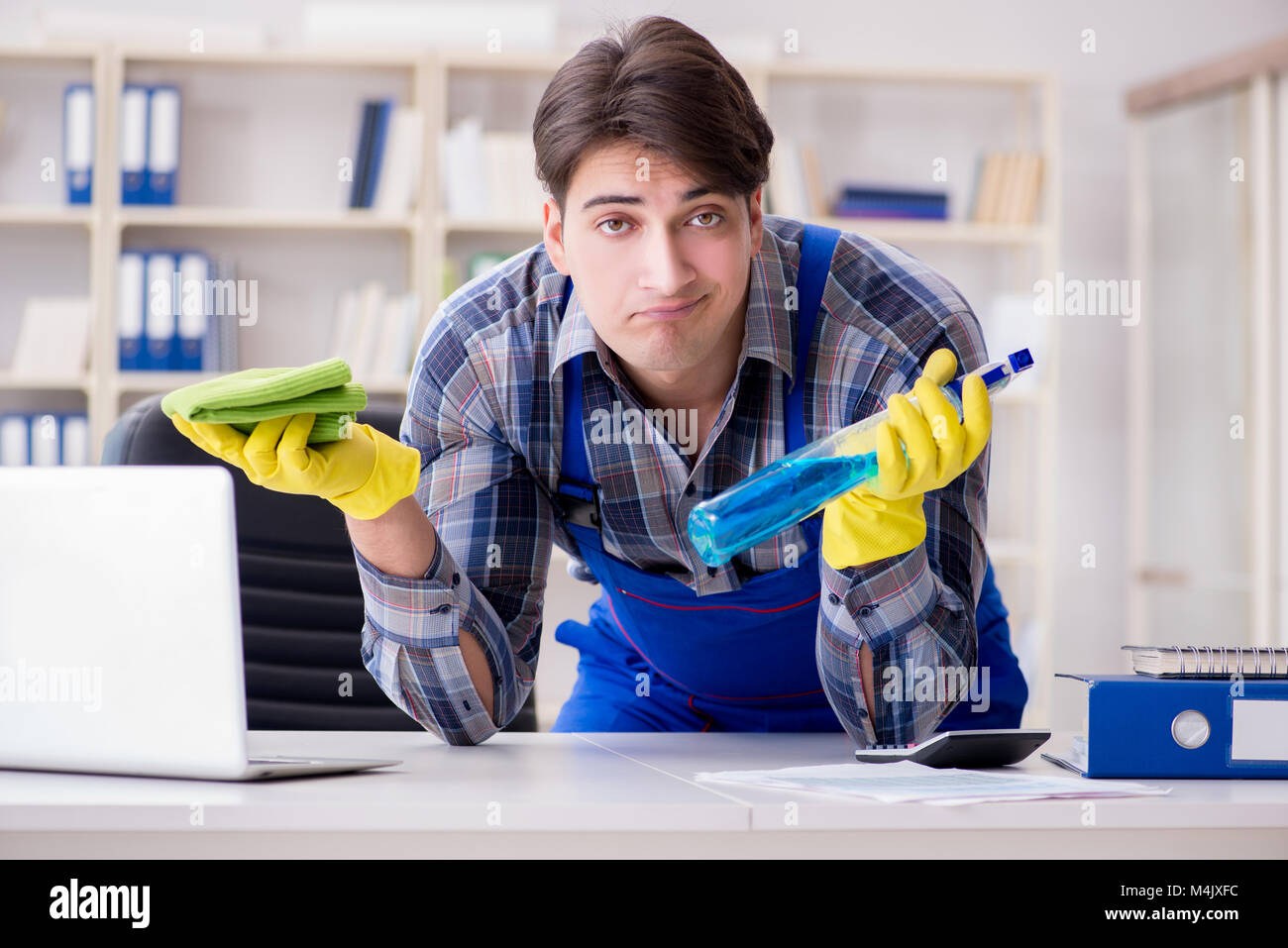 Male cleaner working in the office Stock Photo - Alamy