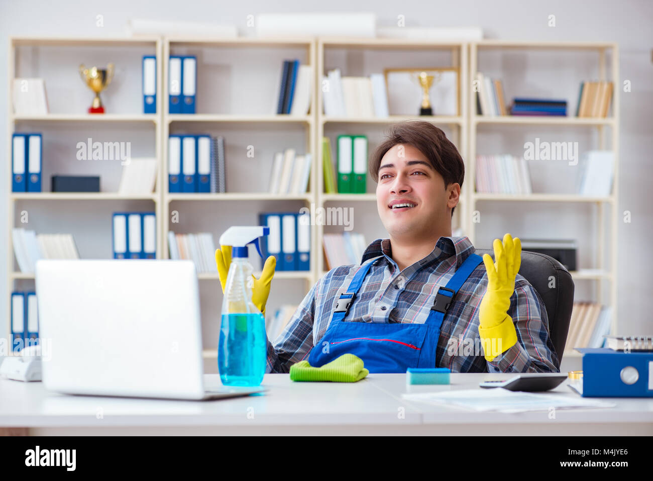 Cleaner man cleaning the office Stock Photo - Alamy