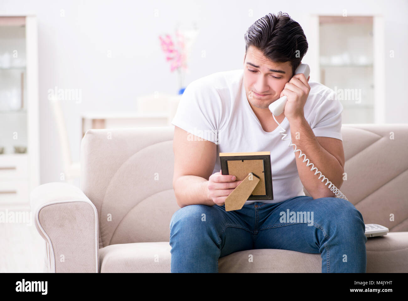 Young man in sad saint valentine concept Stock Photo - Alamy