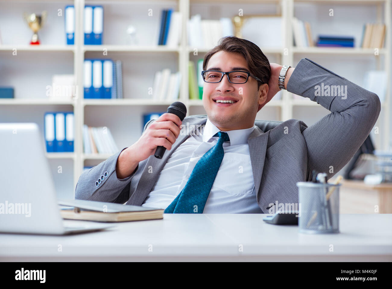 Businessman singing microphone hi-res stock photography and images - Alamy