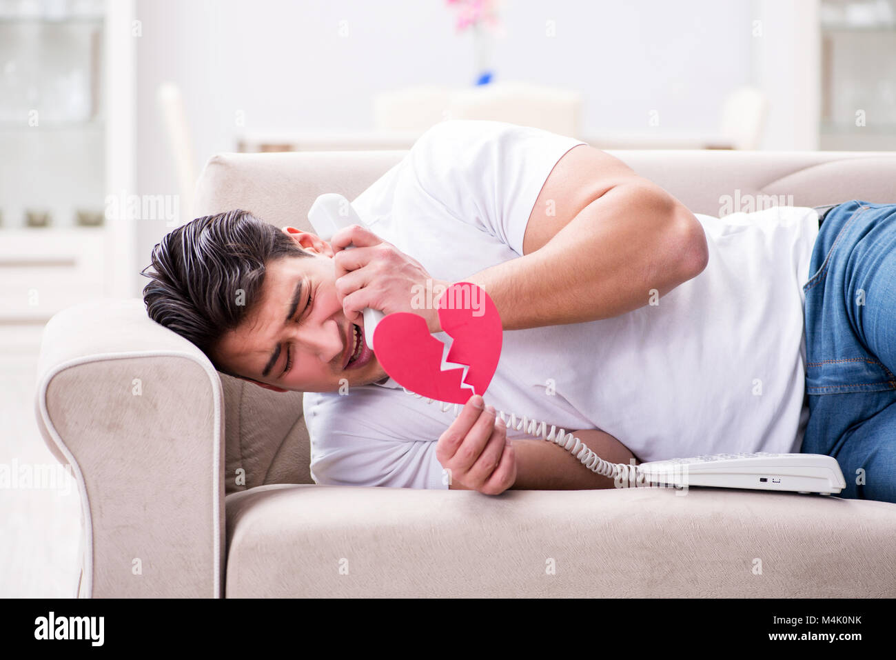 Young man in sad saint valentine concept Stock Photo - Alamy
