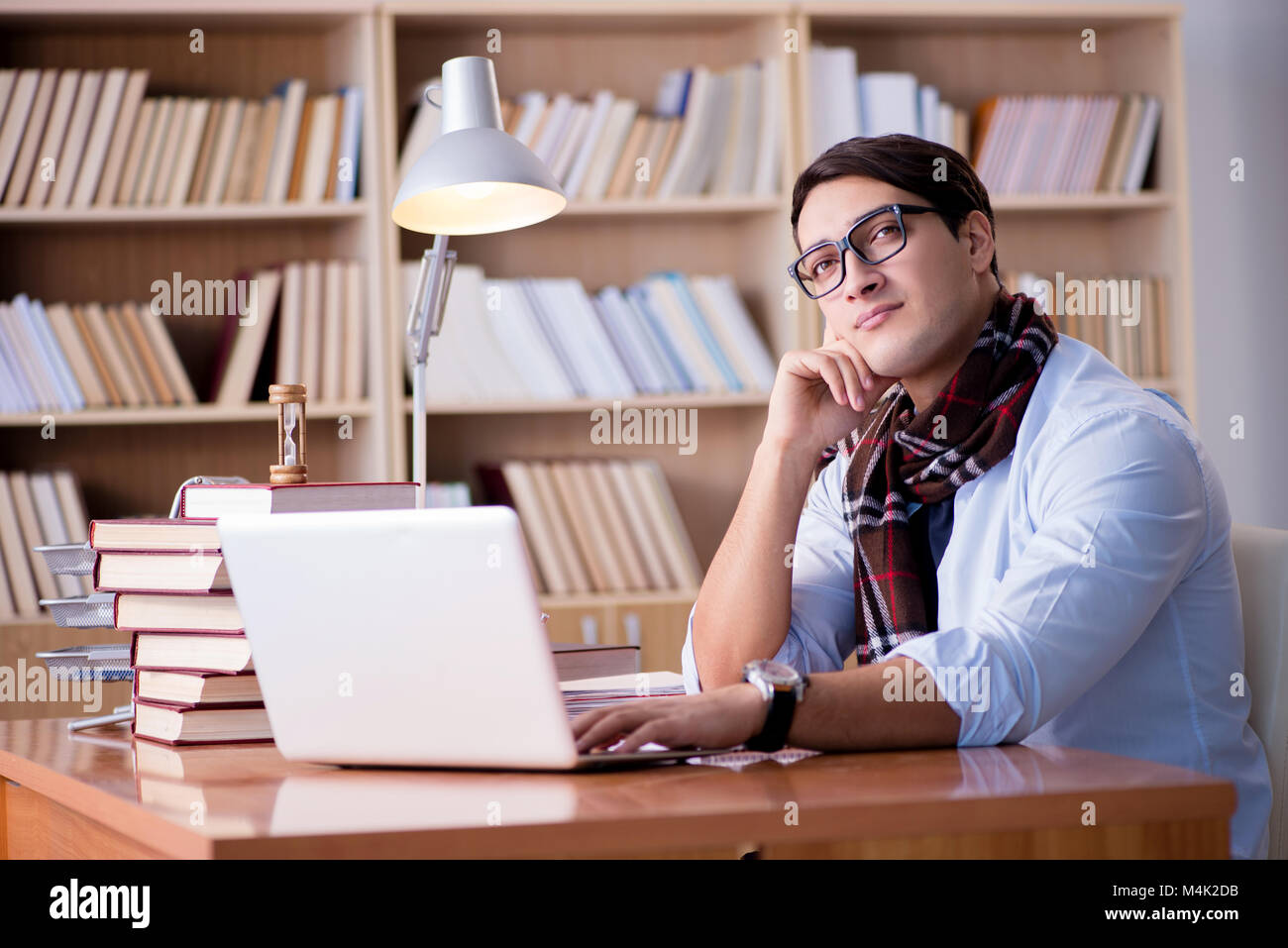 Young writer working in the library Stock Photo - Alamy