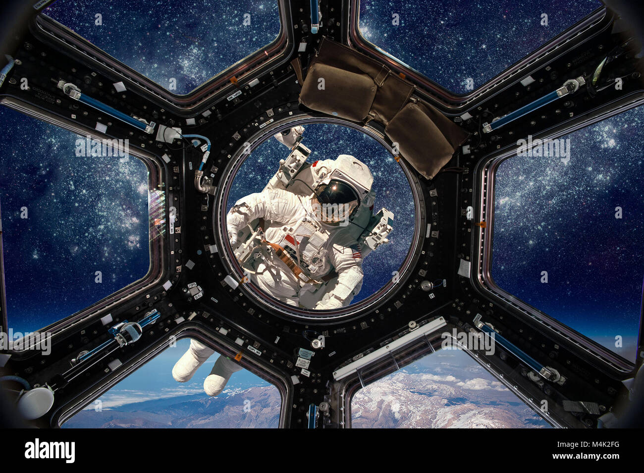 Astronaut in outer space against the backdrop of the planet earth ...