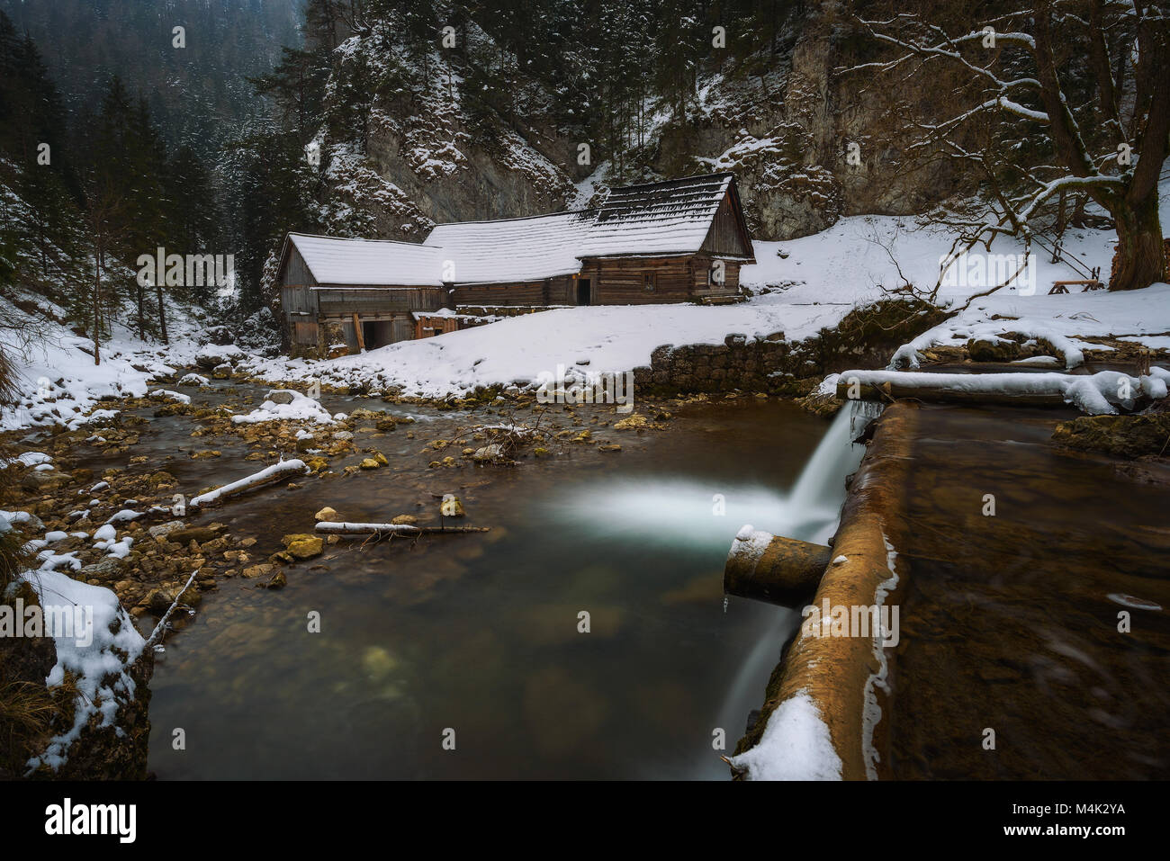 Old wooden water mill in winter Stock Photo - Alamy