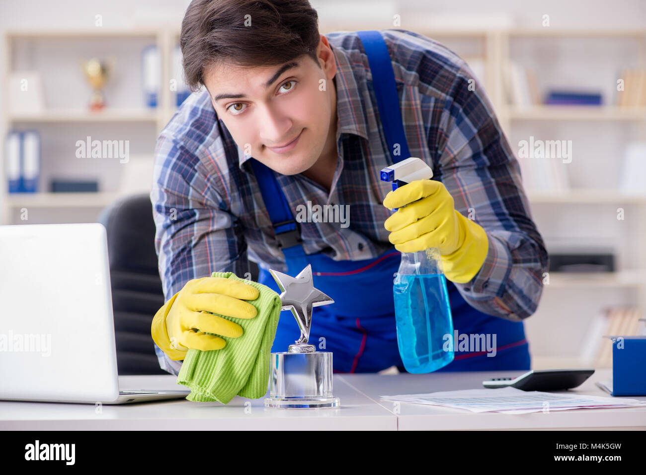 Male cleaner working in the office Stock Photo - Alamy