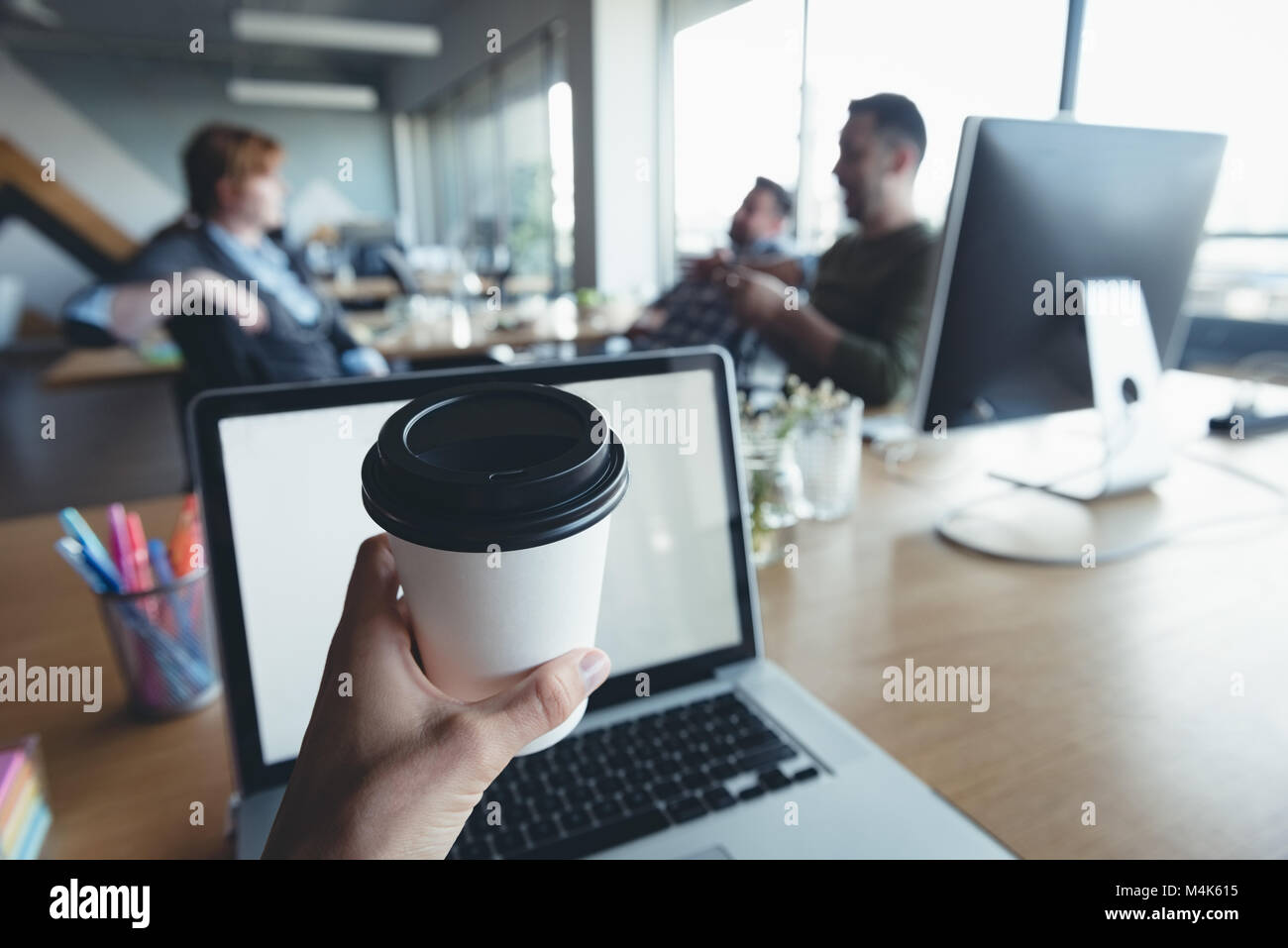 Colleagues talking coffee table hi-res stock photography and images - Alamy