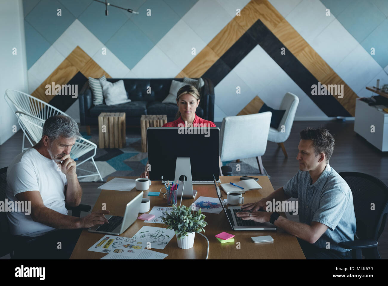 Team colleagues working together hi-res stock photography and images ...