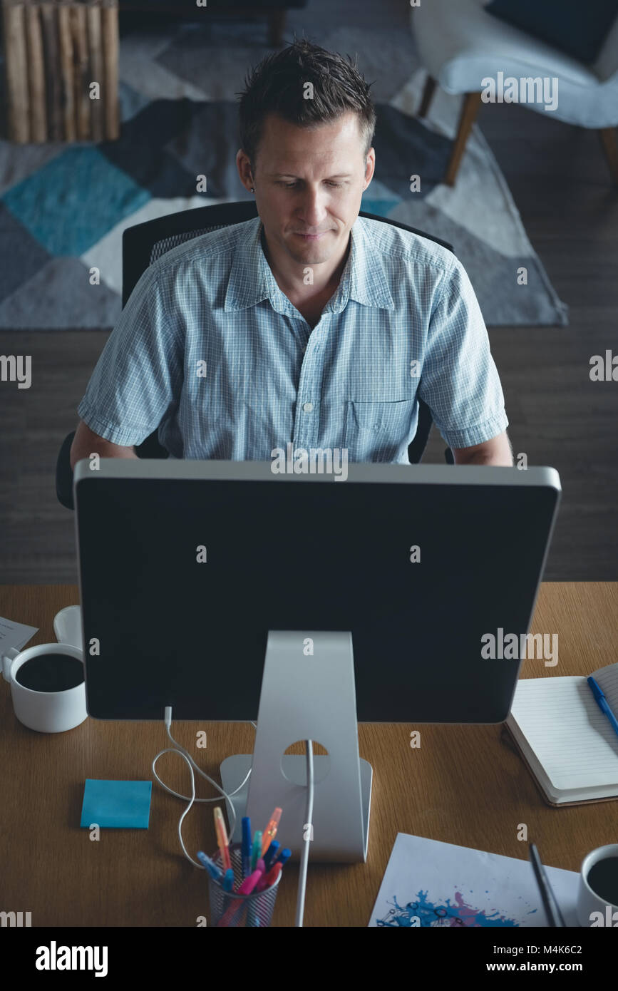 Businessman working on computer table hi-res stock photography and ...