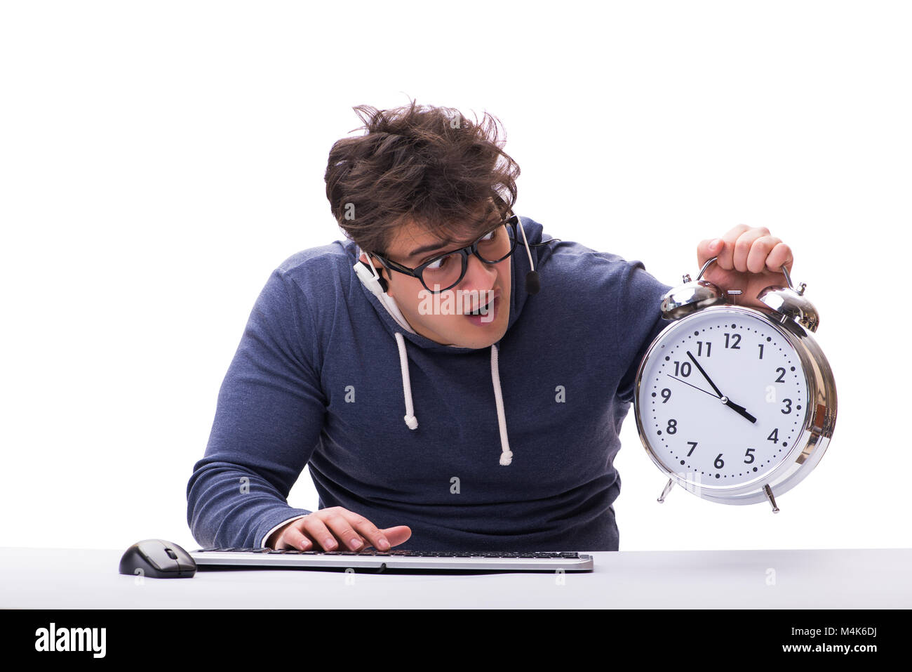 Funny nerd call center operator with giant clock Stock Photo - Alamy
