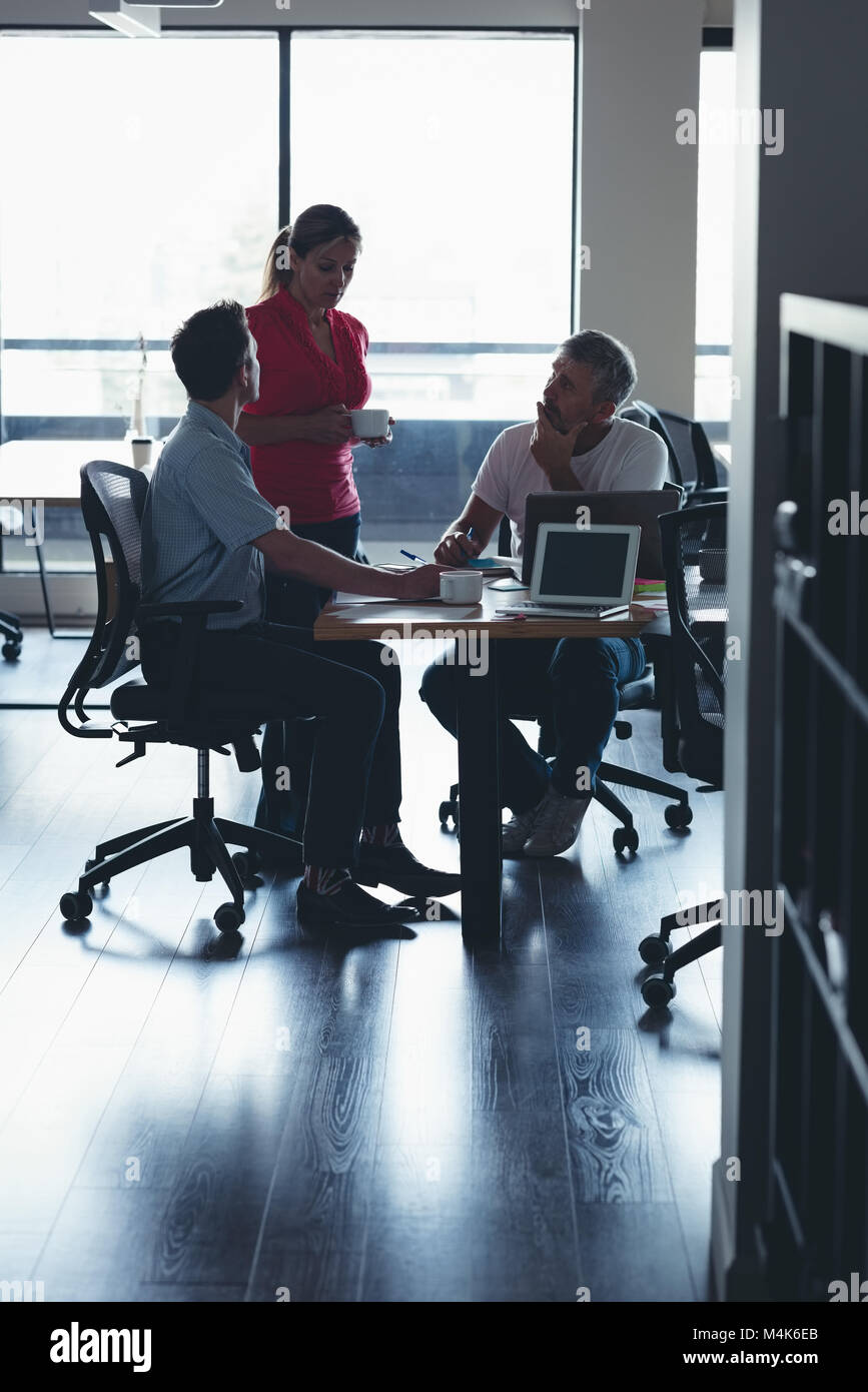 Business people interacting with each other in meeting Stock Photo - Alamy