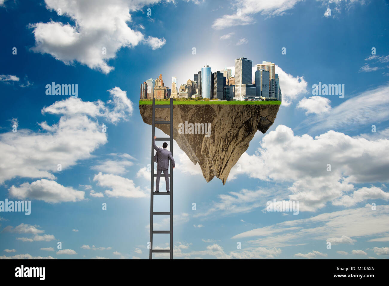 Man climbing ladder to floating island Stock Photo - Alamy