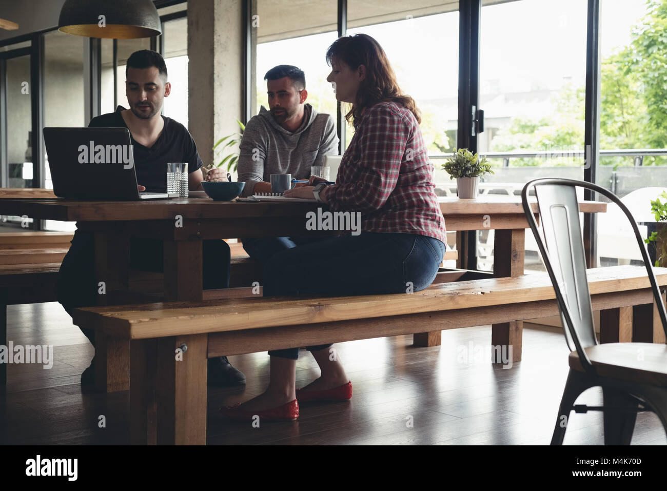 Businessman sitting working in cafeteria hi-res stock photography and ...