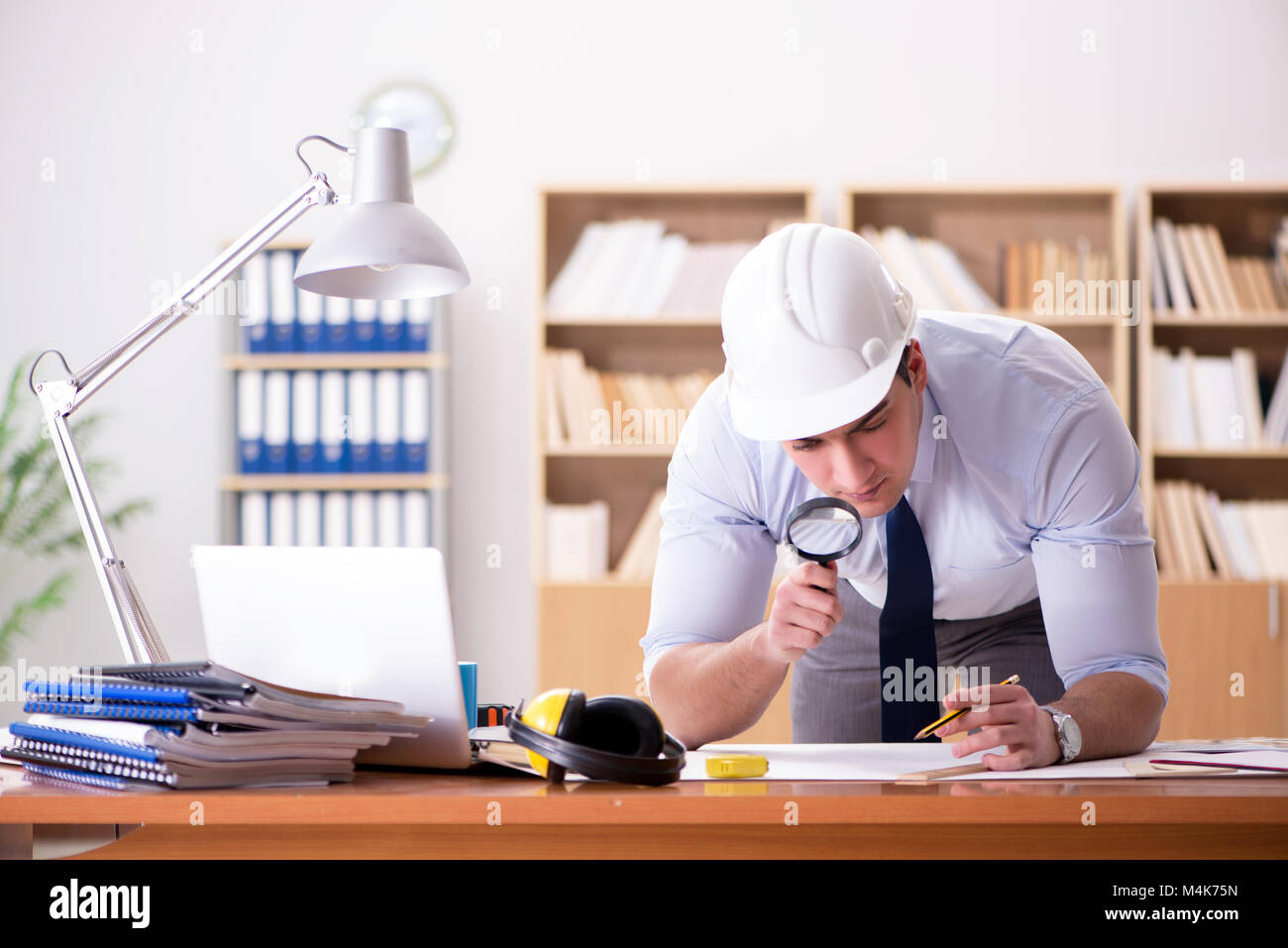 Engineer supervisor working on drawings in the office Stock Photo - Alamy