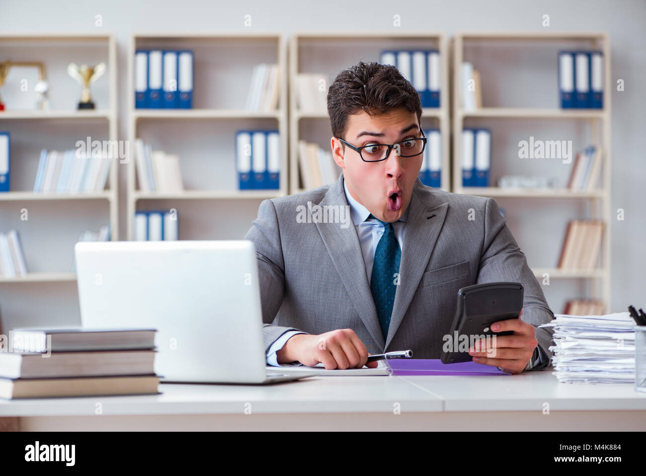 Funny businessman clown acting silly in the office Stock Photo - Alamy