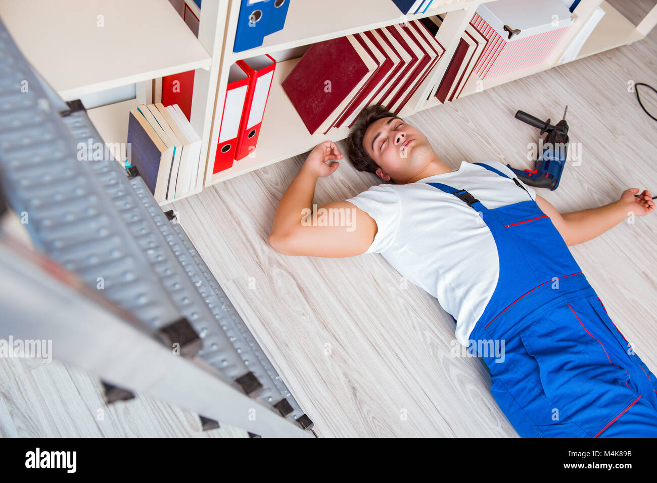 Unsafe behavior concept with falling worker Stock Photo - Alamy