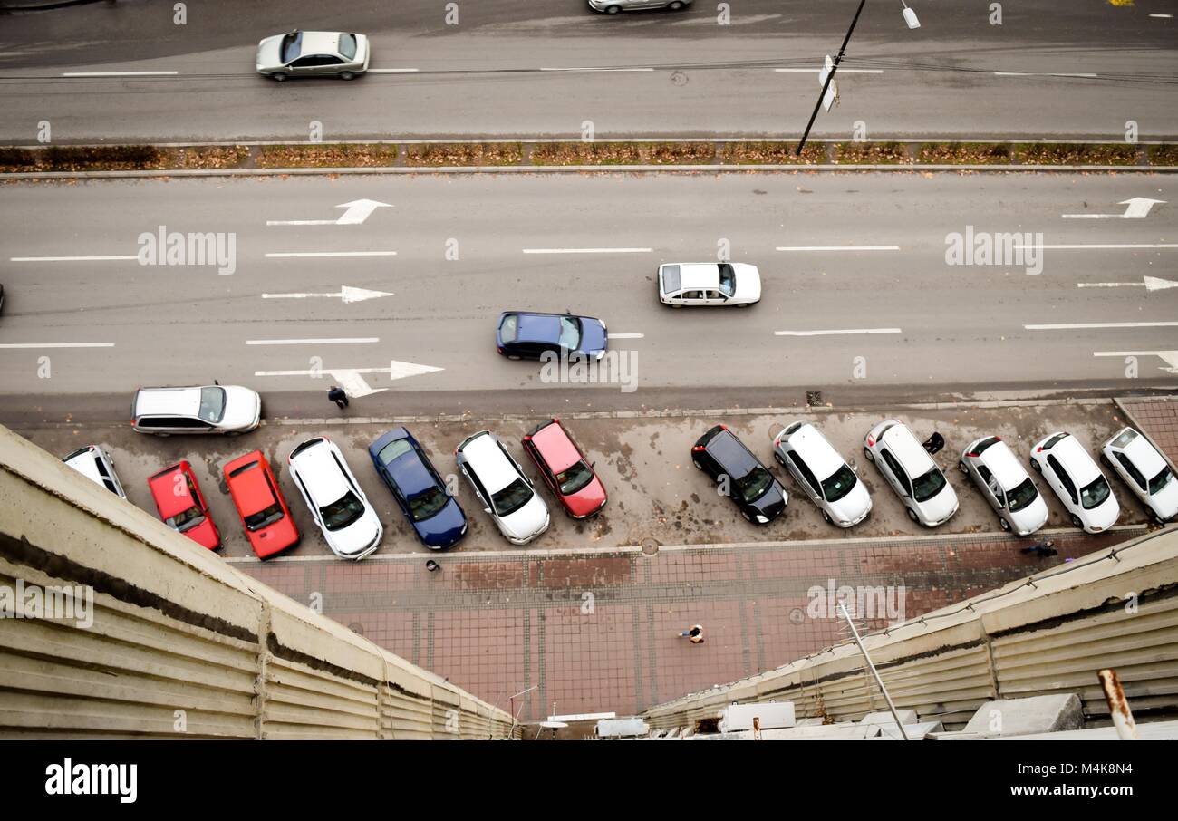 top aerial view on street with parking lot and cars. Urban scene with ...