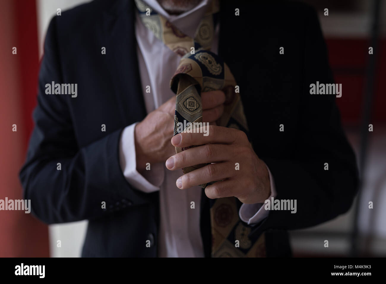Tying his tie well hi-res stock photography and images - Alamy