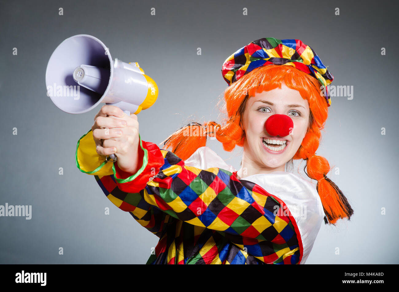 Funny clown in comical concept Stock Photo - Alamy