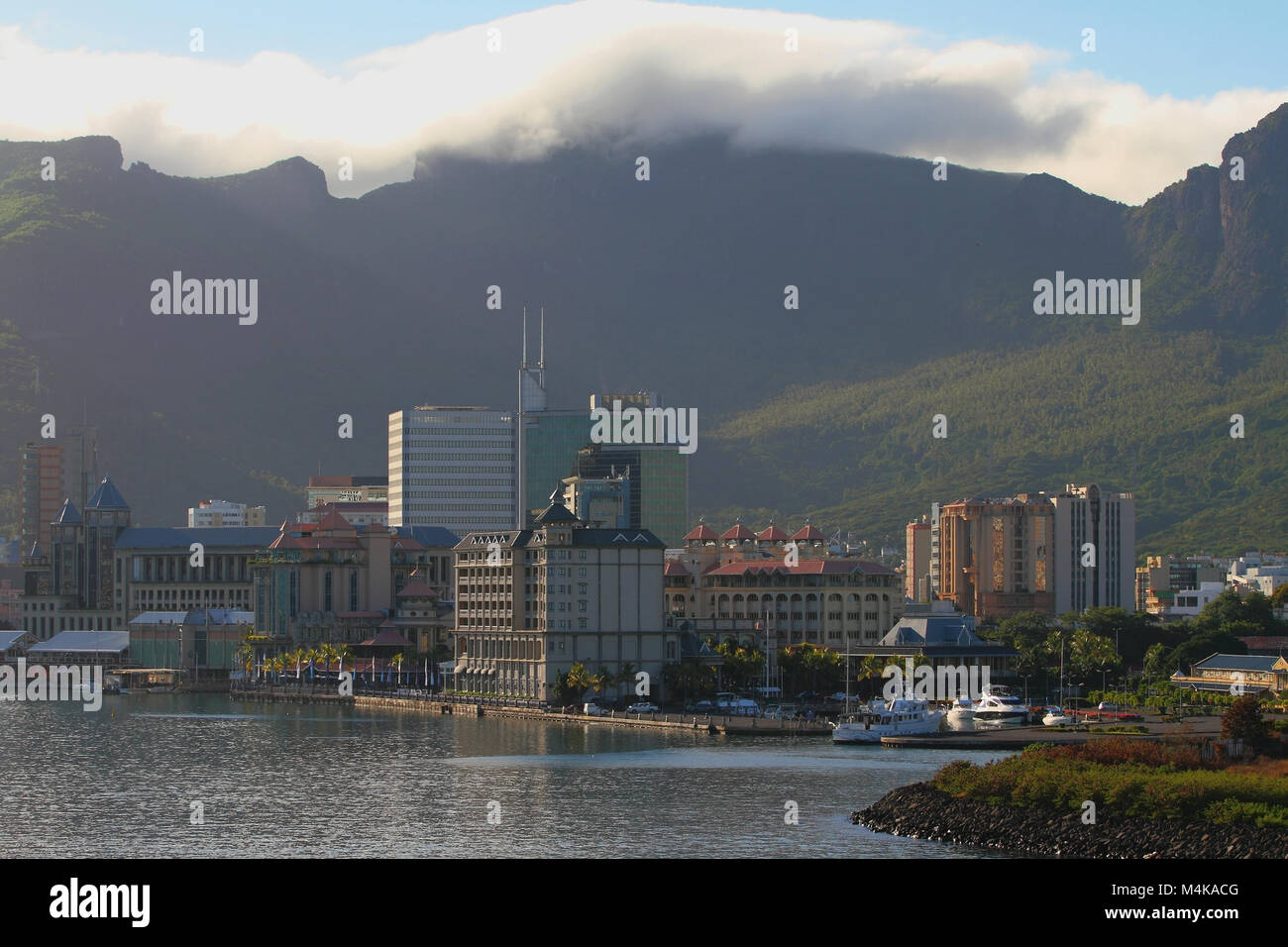 City and mountain ridge on coast. Port Louis, Mauritius Stock Photo - Alamy