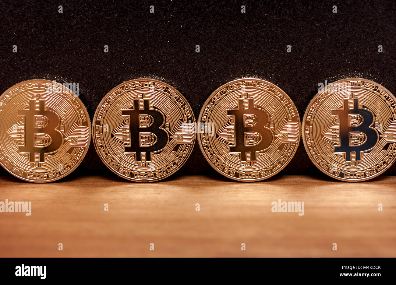 Four golden coins hi-res stock photography and images - Alamy