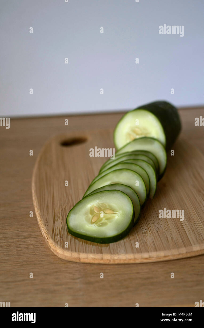 Healthy Food Choice Slicing Cucumbers on Kitchen Counter Stock Photo ...