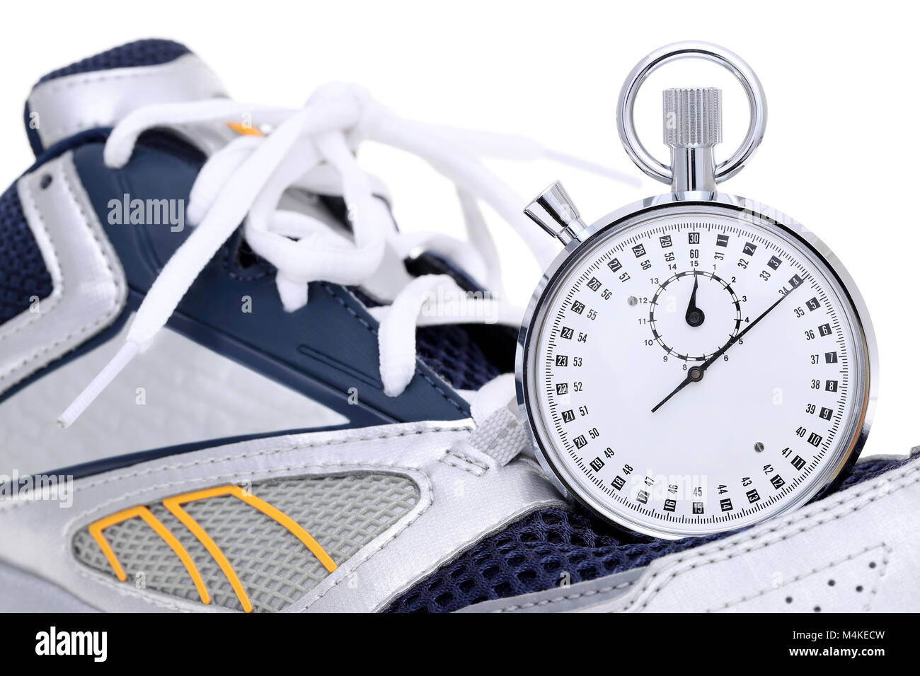 analogue stopwatch with sport running shoes on white background Stock ...