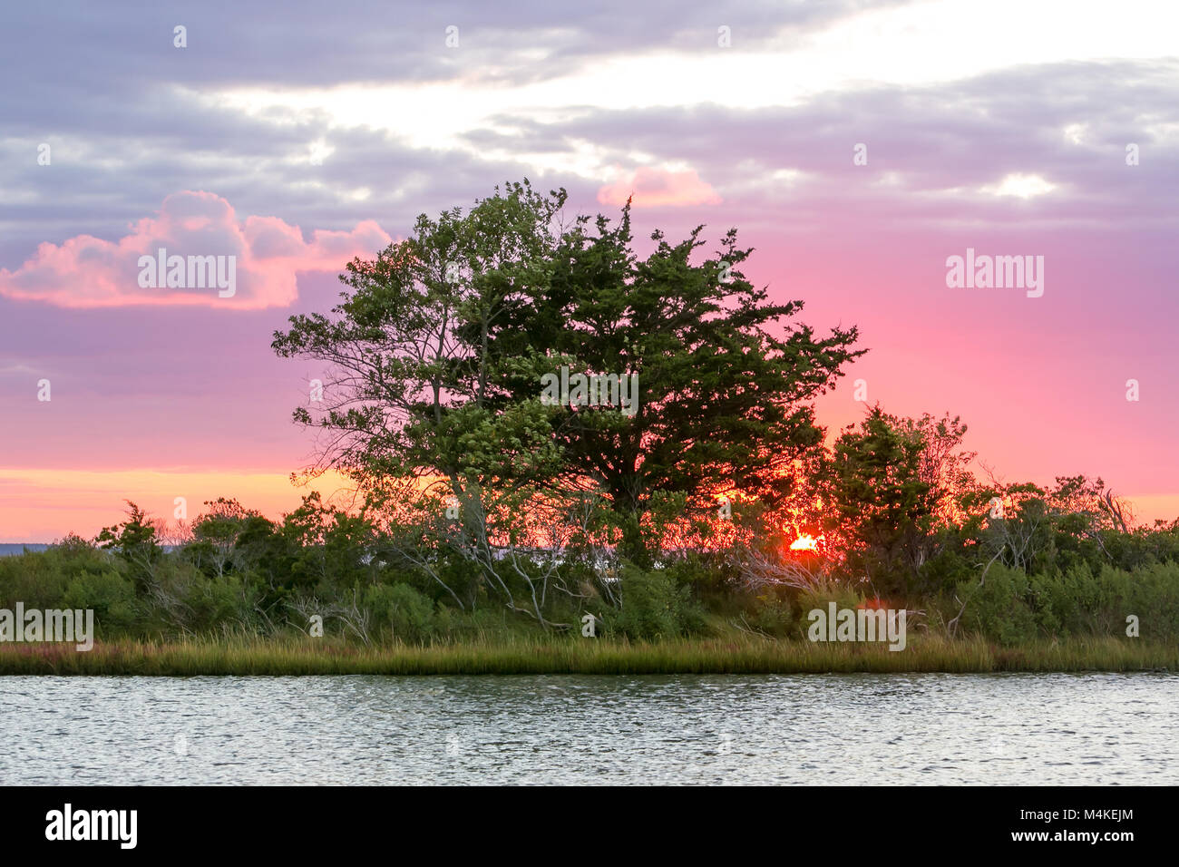 A brilliant sunset on the bay at Assateague Island National Seashore ...