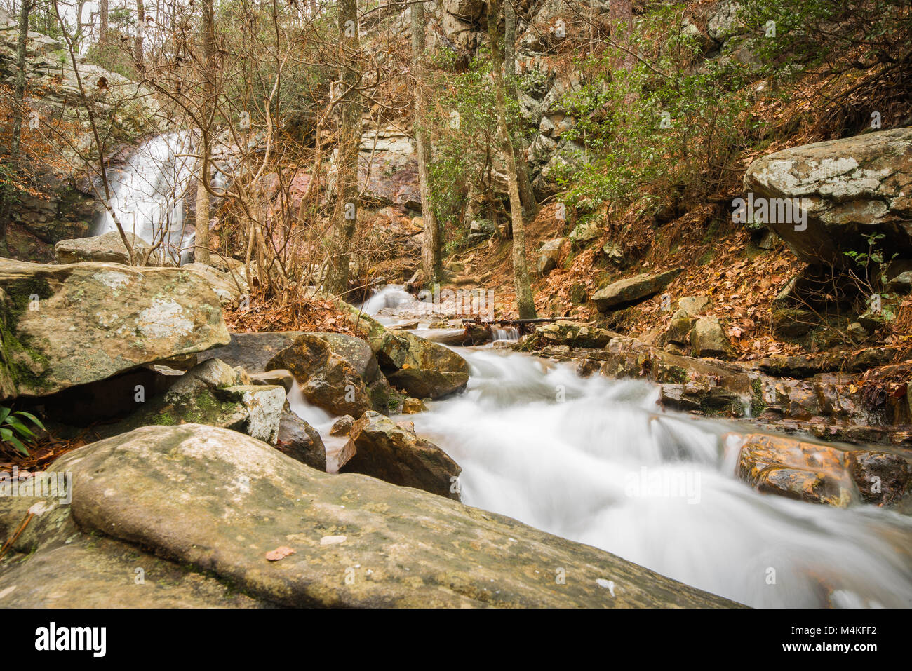 A beautiful, hard to find waterfall flows into a ravine near the top of ...