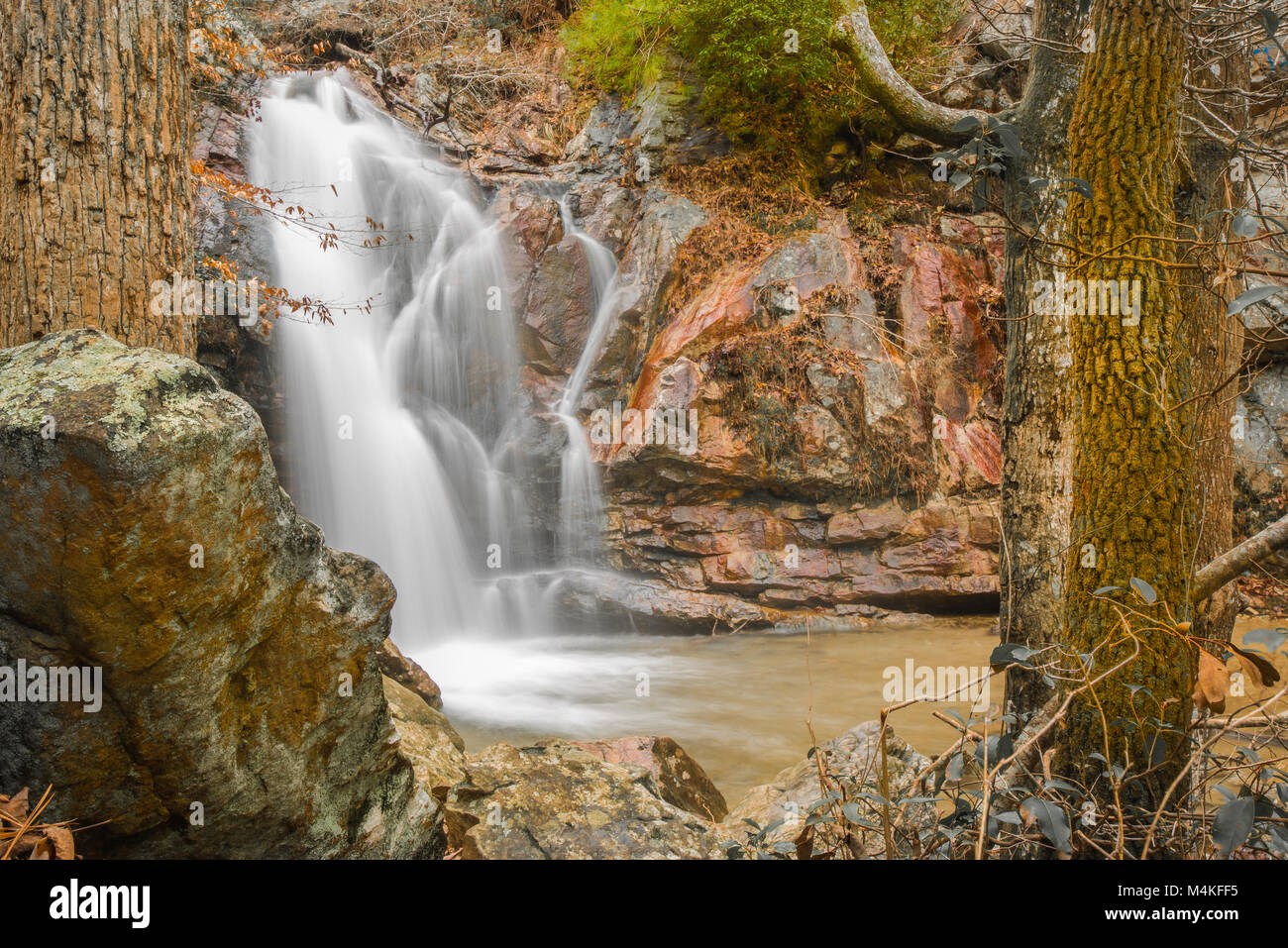 A beautiful, hard to find waterfall flows into a ravine near the top of ...