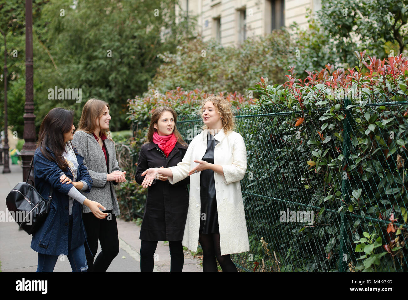 International students talking with teacher outdoors in Stock Photo - Alamy