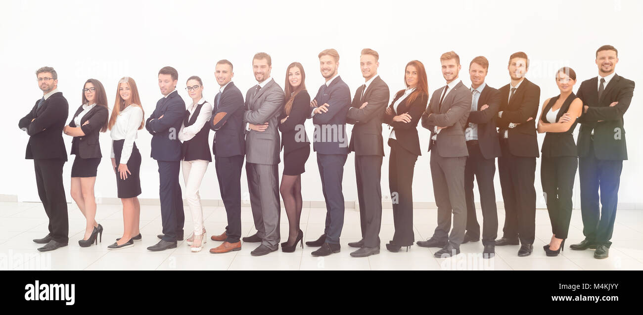 large business team standing arms crossed in front. isolated on white ...