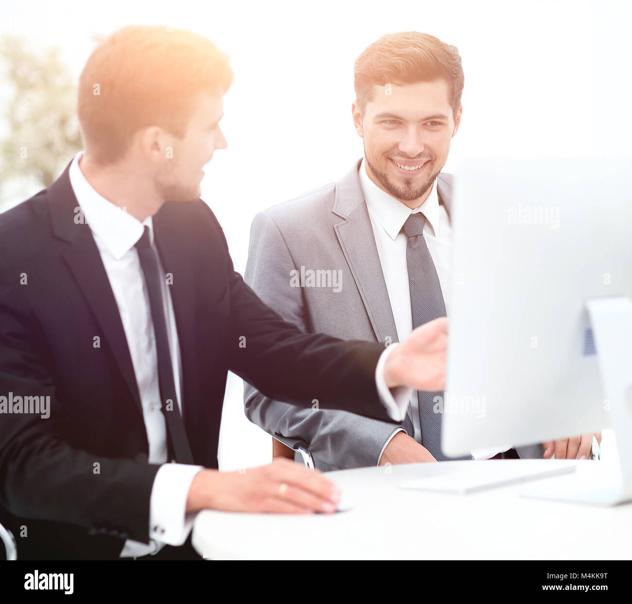 employees are talking sitting behind a Desk. office life Stock Photo ...