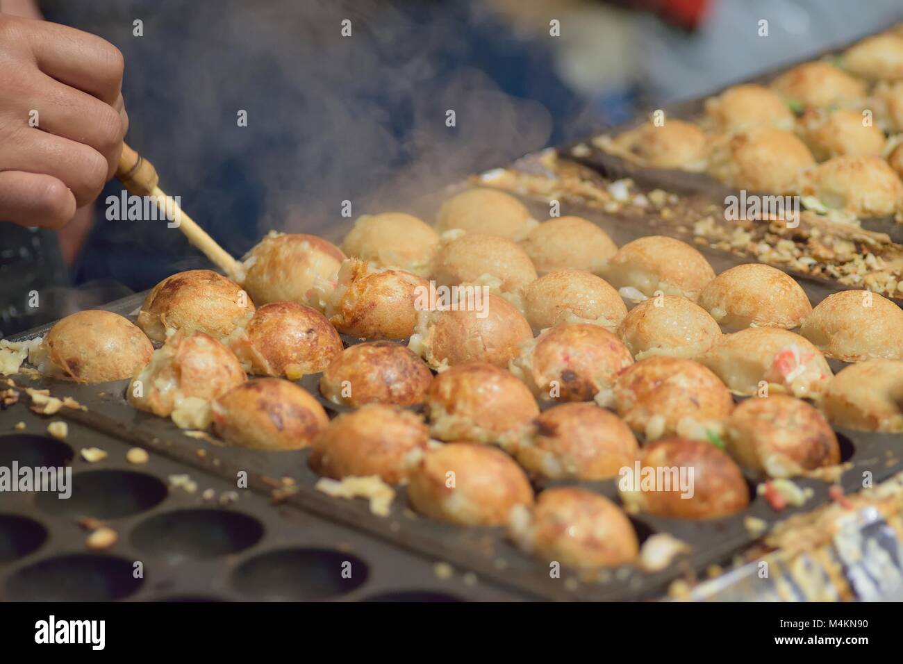 Tokyo street food of Octopus meat balls called Takoyaki Stock Photo - Alamy