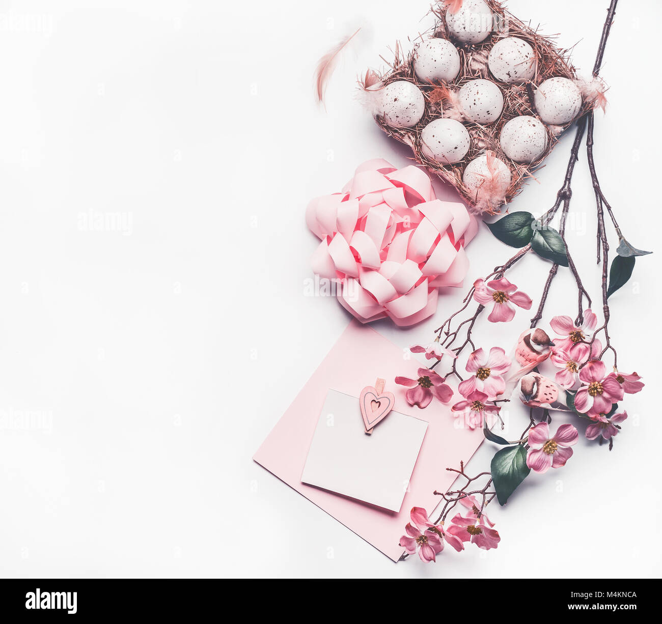 Pastel pink Easter composing with greeting card mock up with blossom ...