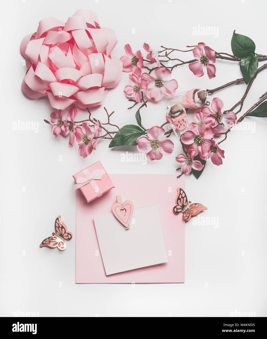 Pretty pastel pink greeting card mock up with blossom decoration ...