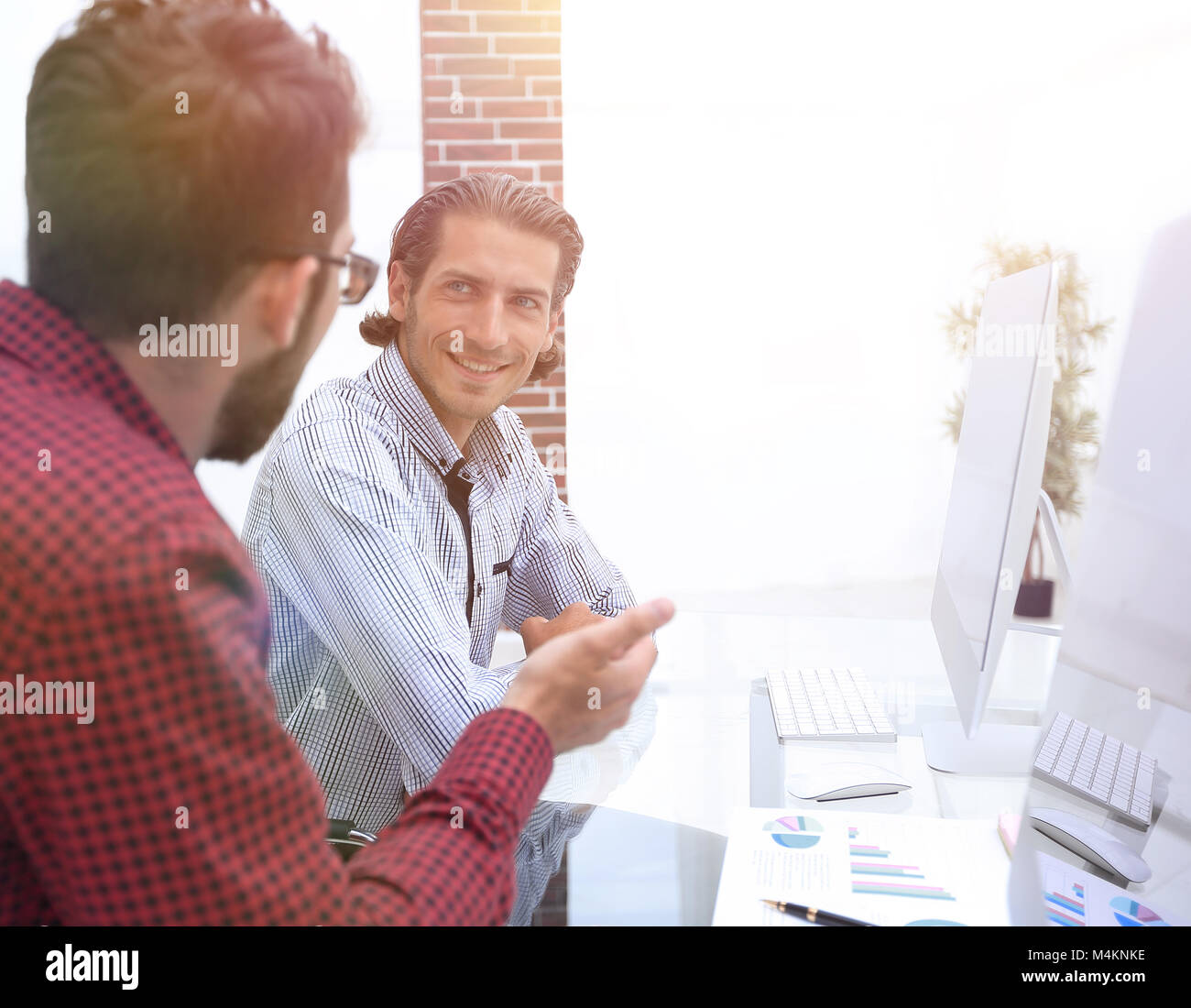 employees sitting behind a Desk Stock Photo - Alamy