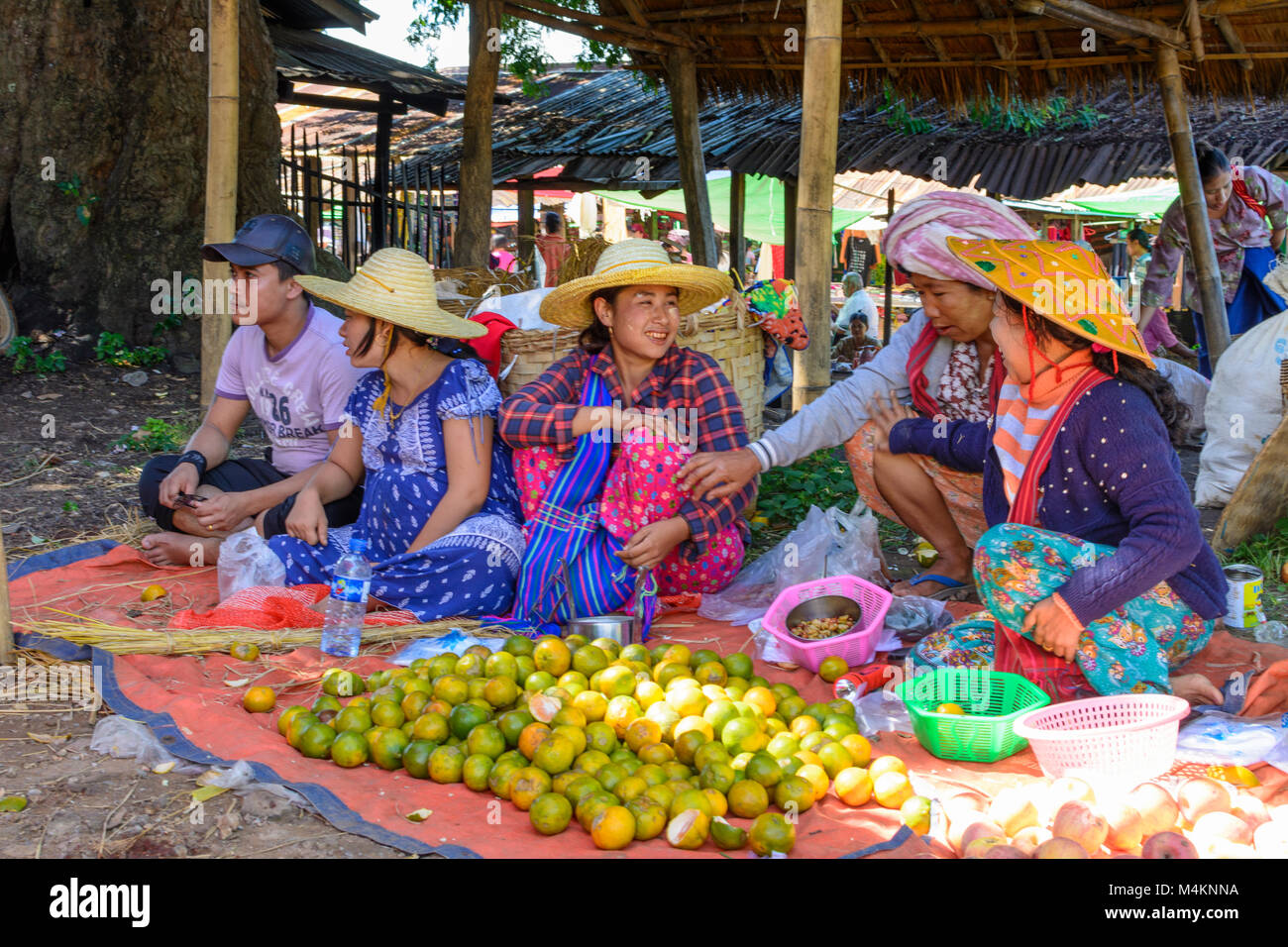 Maing Thauk: rotating market, vendor woman women, Intha people, fruit ...