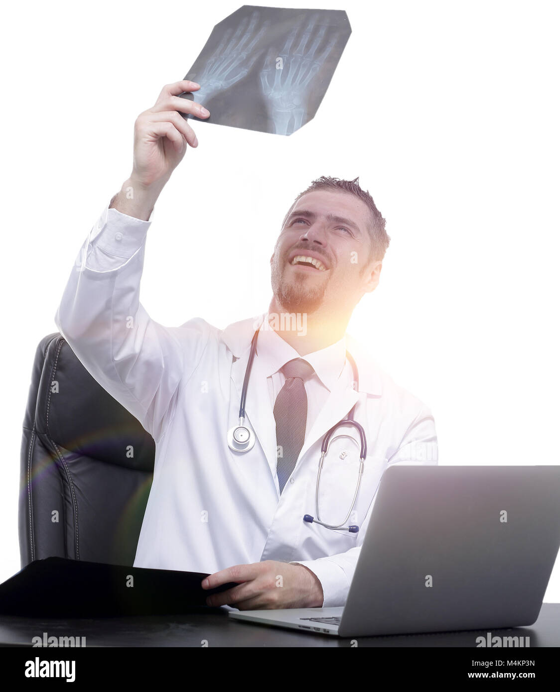 doctor examines an x-ray,sitting behind a Desk.isolated on white ...