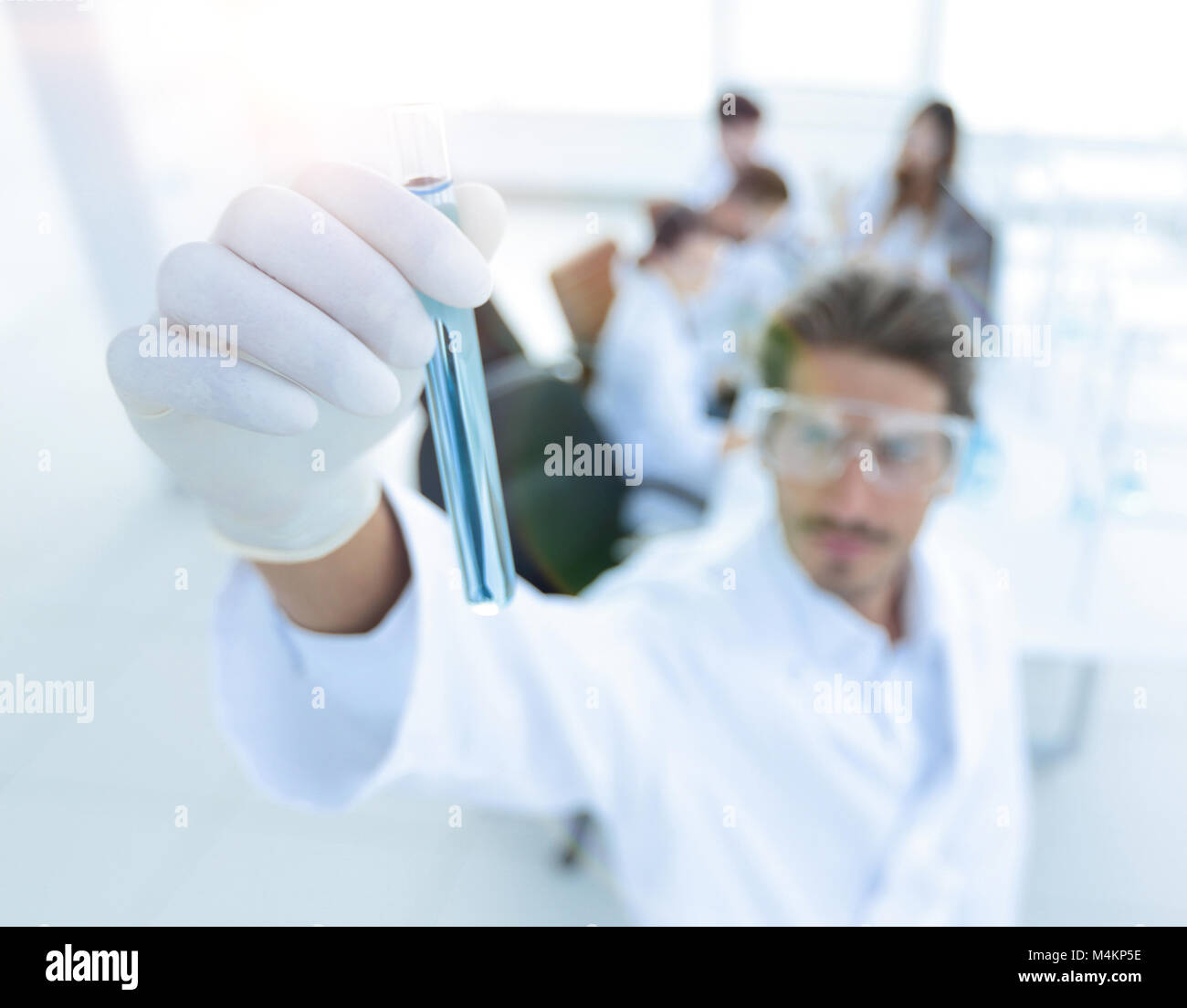 tube with reagents on blurred background laboratory.the concept of ...