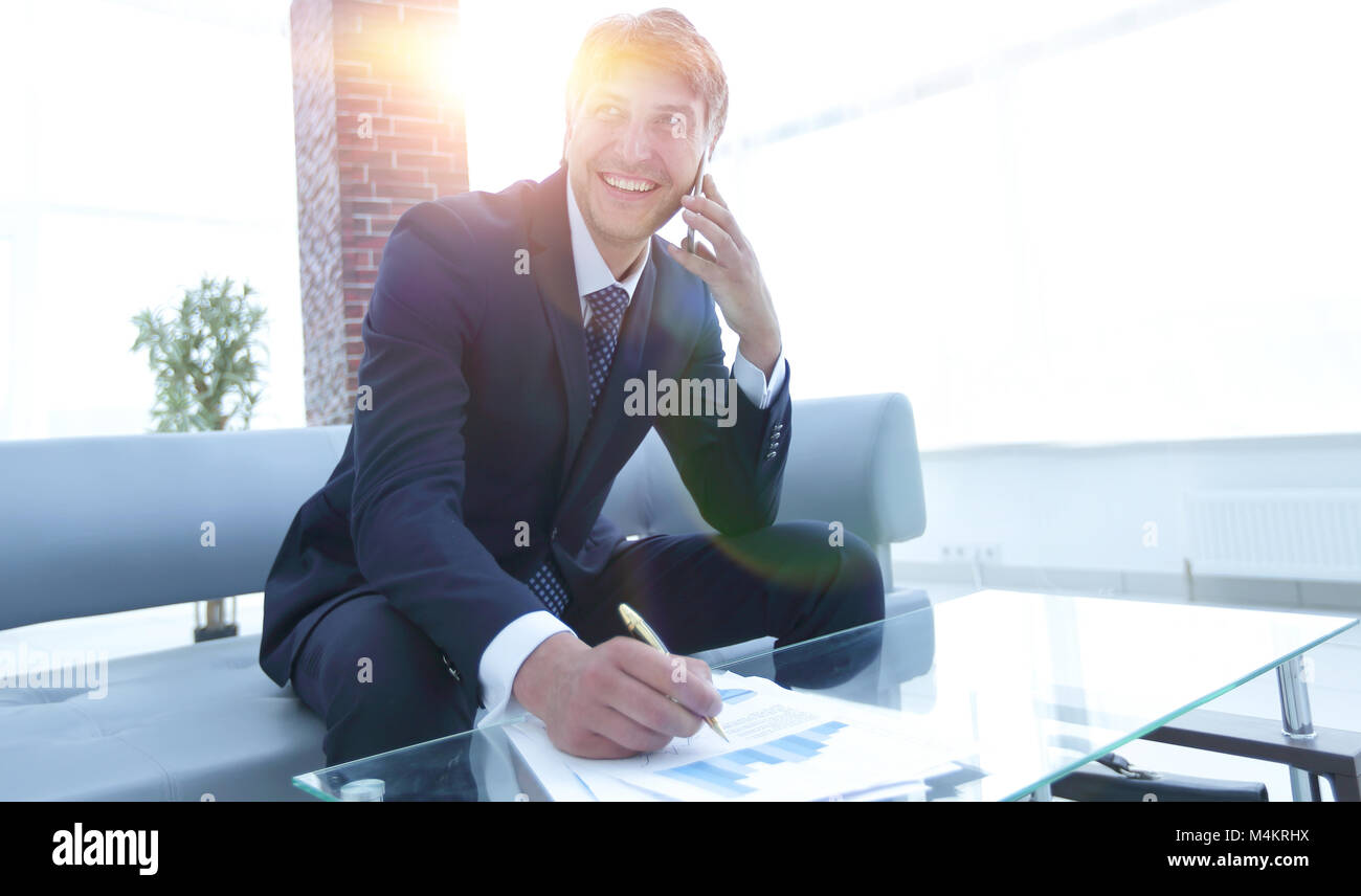 Smiling lawyer talking on smartphone in office Stock Photo - Alamy