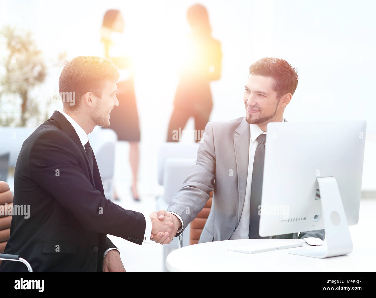 handshake Manager and the client in the office. photo with copy space ...