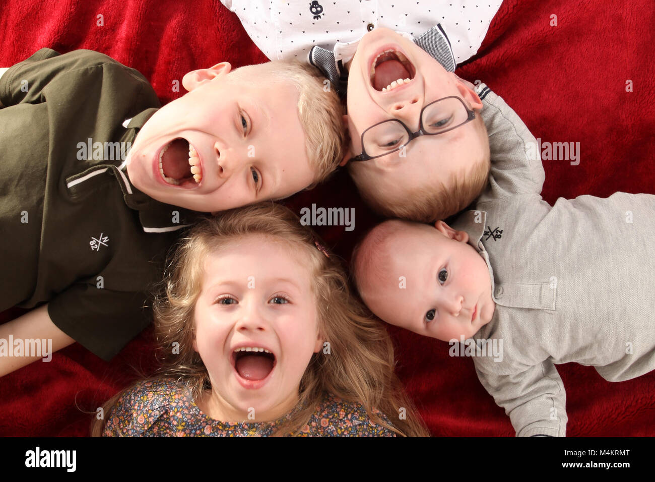family life,four siblings happy and playing together, Big family Stock ...